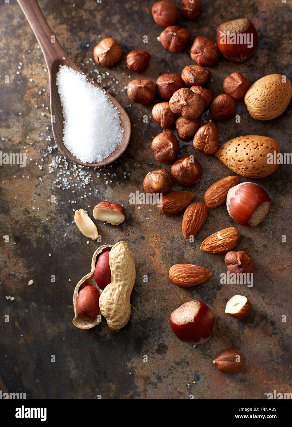 Nuts, almonds and wooden spoon of sugar Stock Photo - Alamy