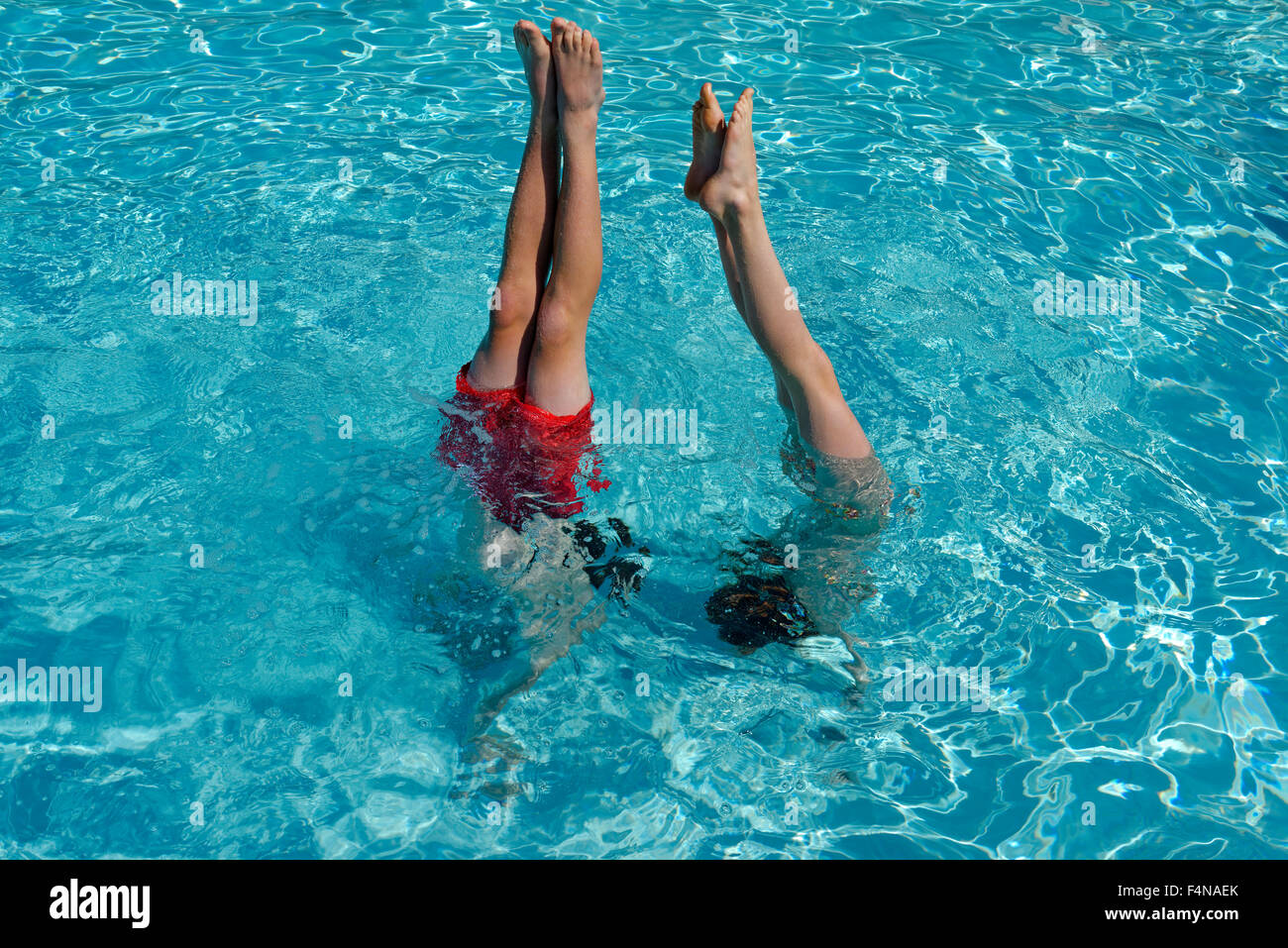 Teenage Boy And Girl Swimming