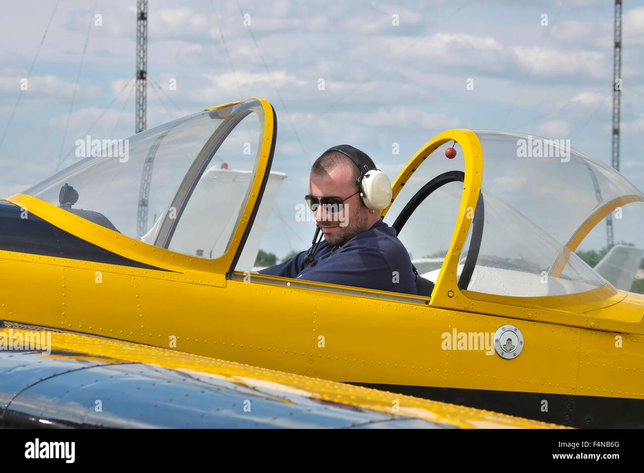 Pilot starting the engineof a light aerobatic plane Stock Photo - Alamy
