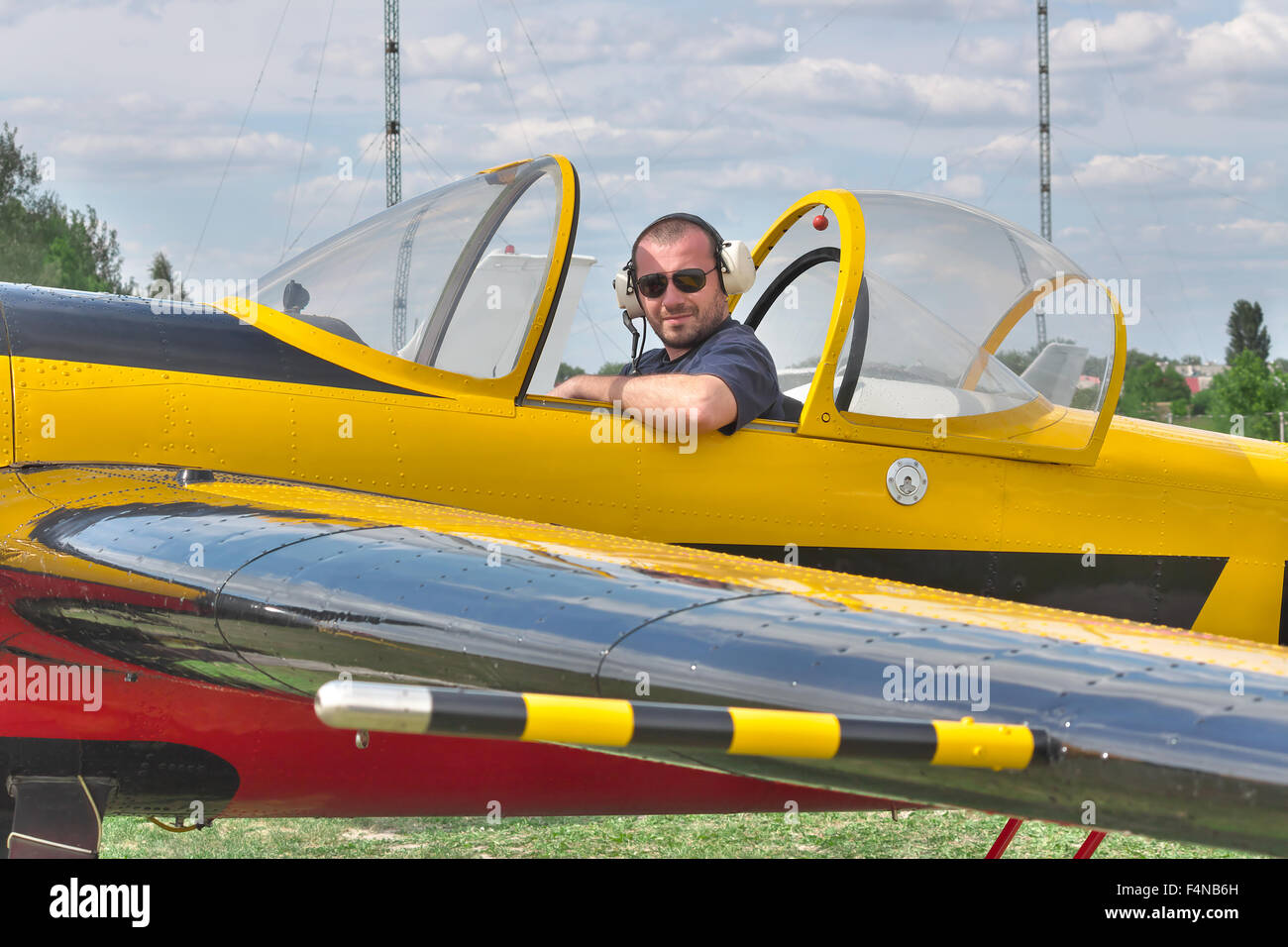 Pilot sitting in the cockpit of a light aerobatic plane Stock Photo - Alamy