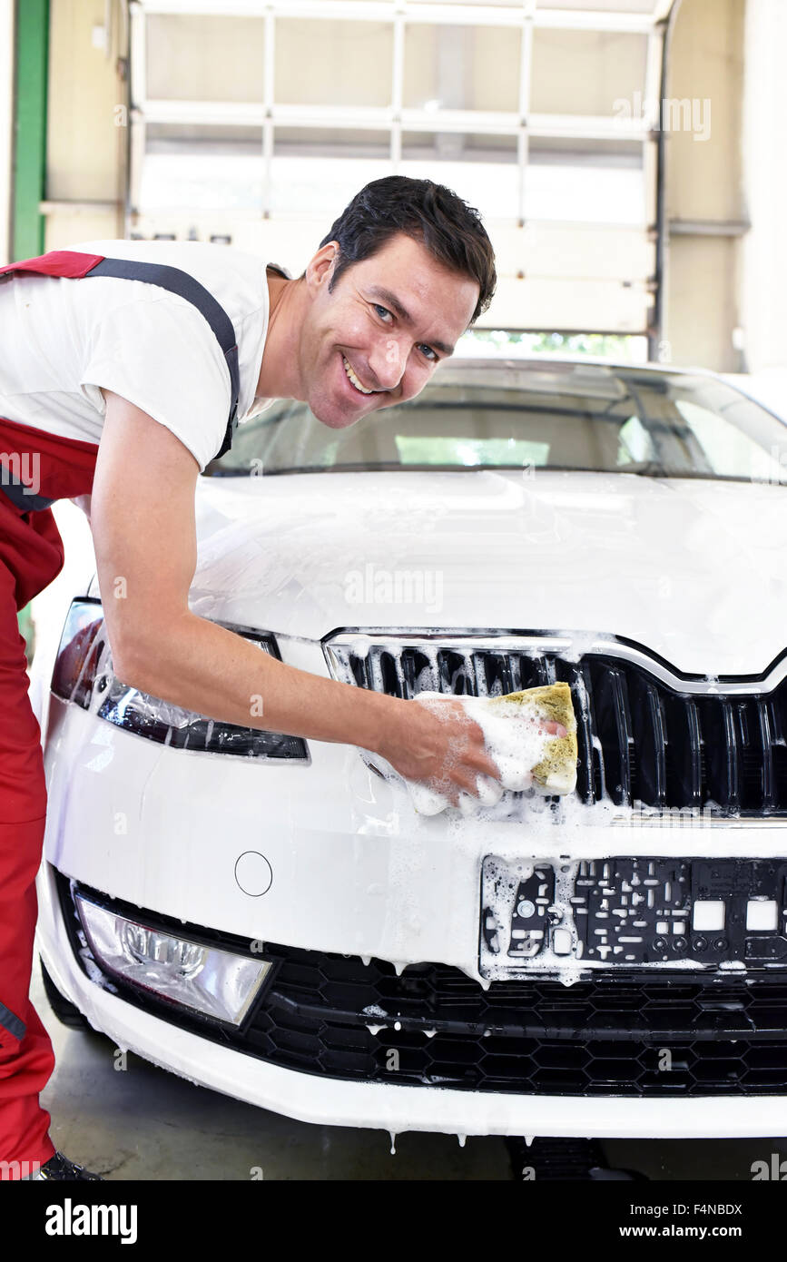 Car cleaning, man cleaning car with sponge Stock Photo - Alamy