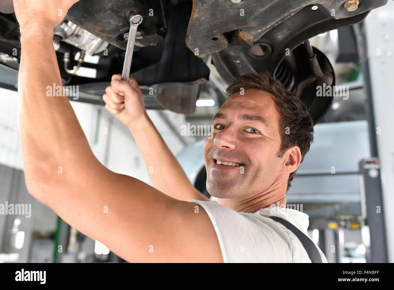 Car mechanic working in repair garage Stock Photo - Alamy