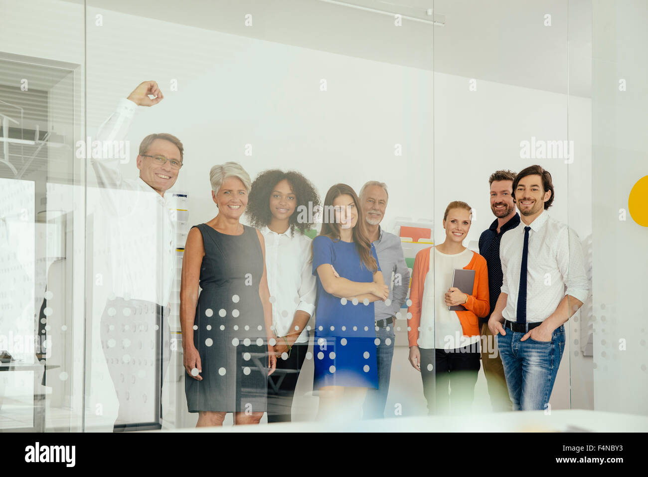 Portrait of smiling staff in office Stock Photo - Alamy