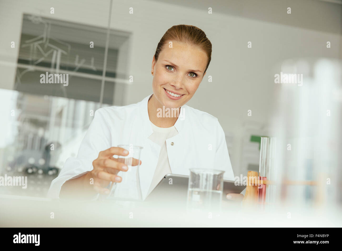 Portrait of smiling female scientist in lab Stock Photo - Alamy
