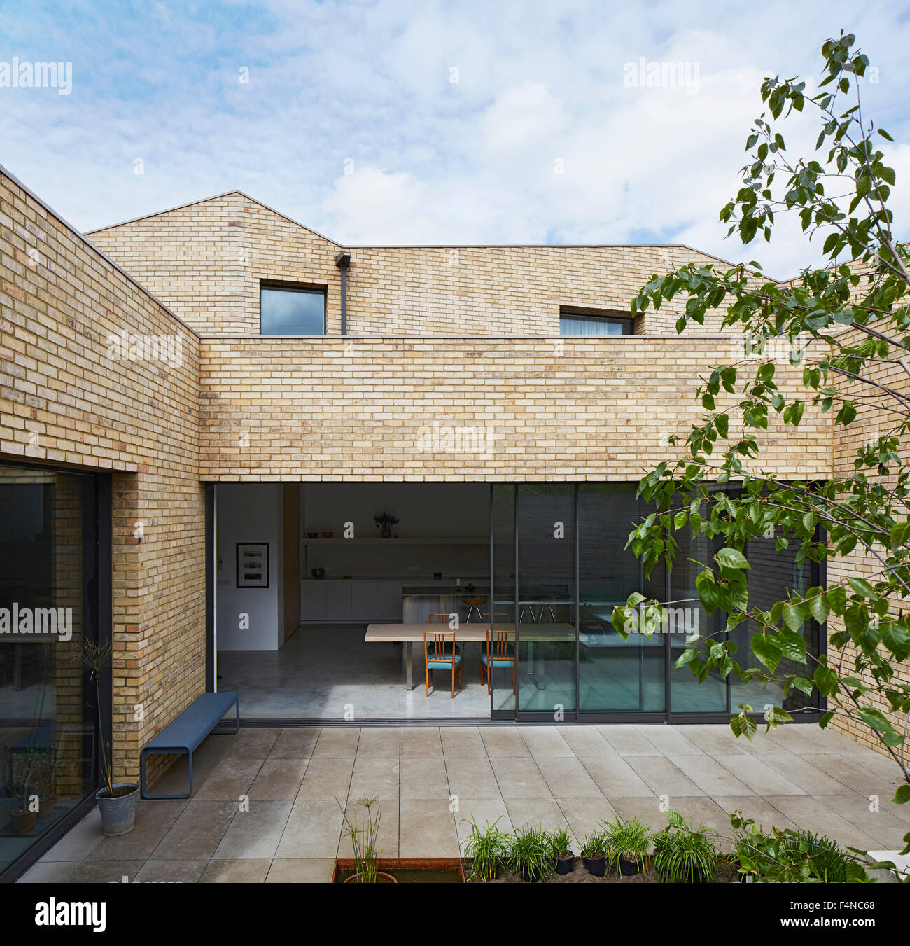 Courtyard elevation with open sliding doors. Luker House, London ...