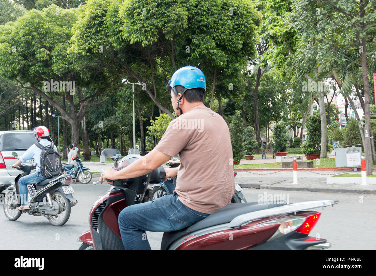 Vietnamese man riding his motorbike motorcycle through the streets of ...