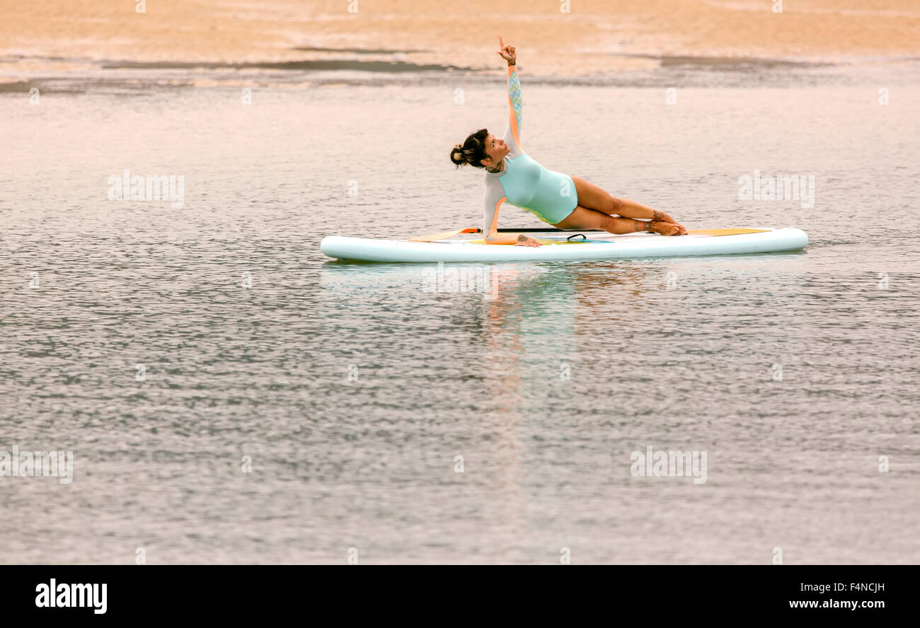 Paddle board yoga hi-res stock photography and images - Alamy