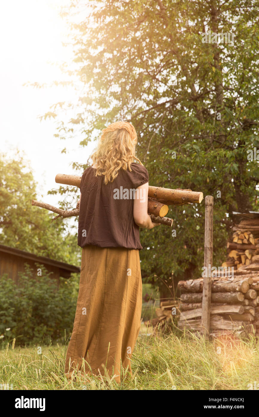 Old woman carrying wood hi-res stock photography and images - Alamy