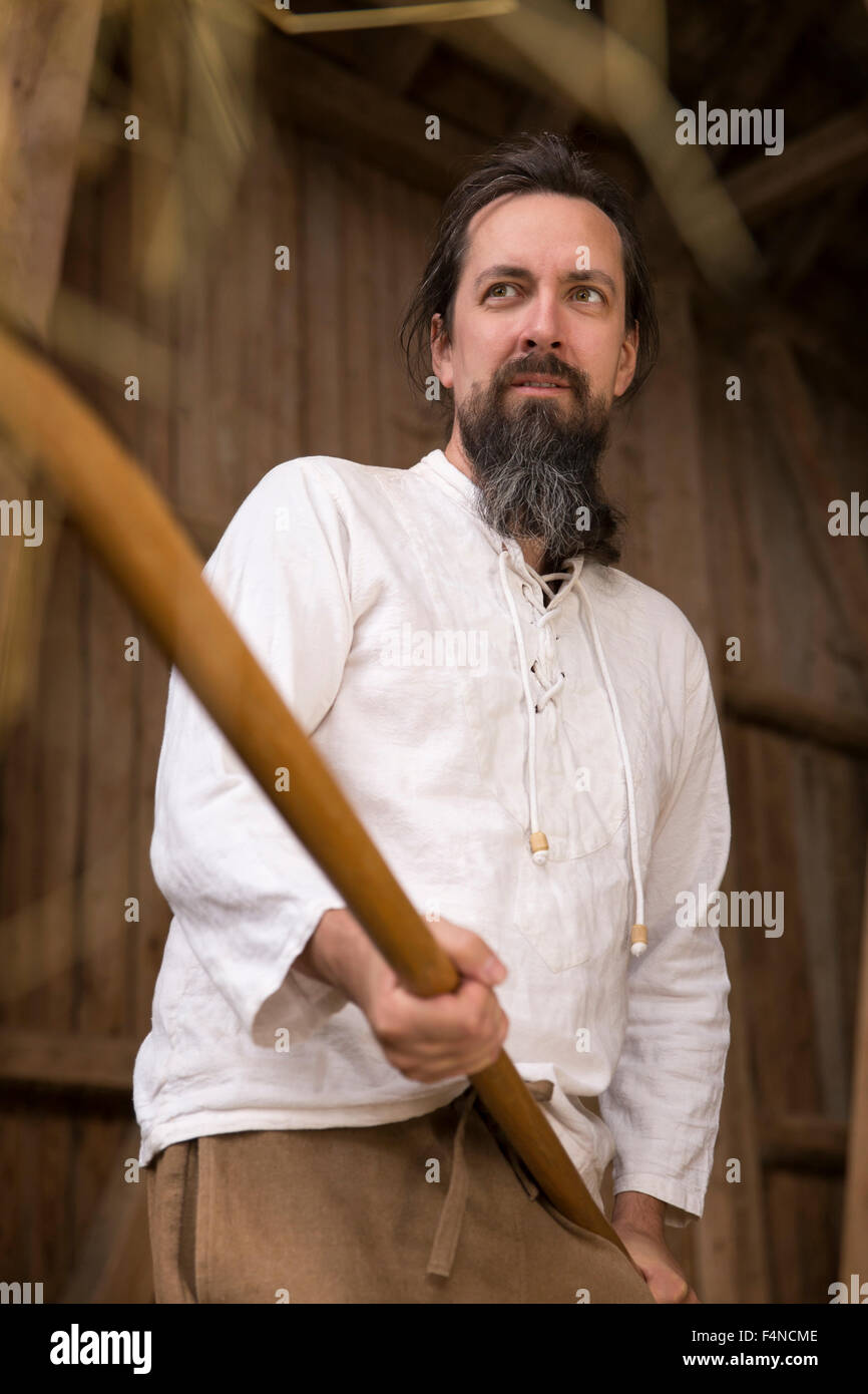 Farmer working in barn Stock Photo - Alamy