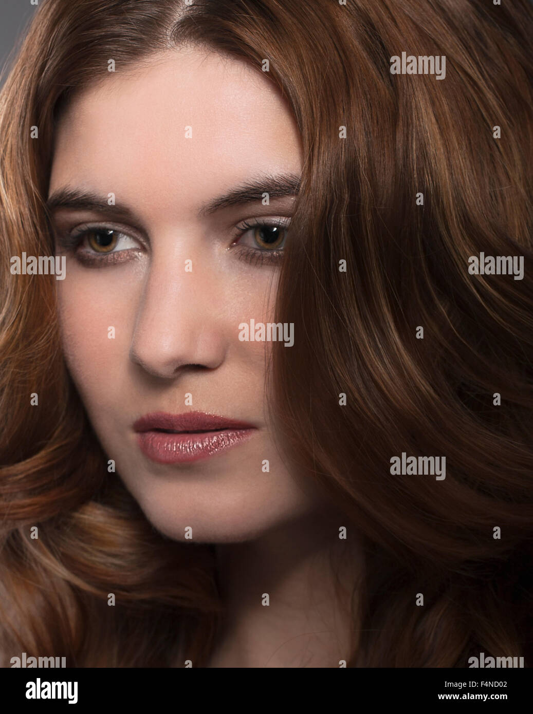 Portrait of rouged young woman with brown hair and brown eyes Stock ...