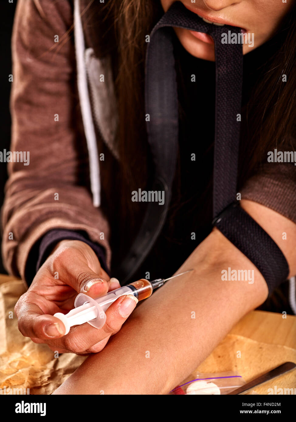 Female drug addict with syringe Stock Photo - Alamy