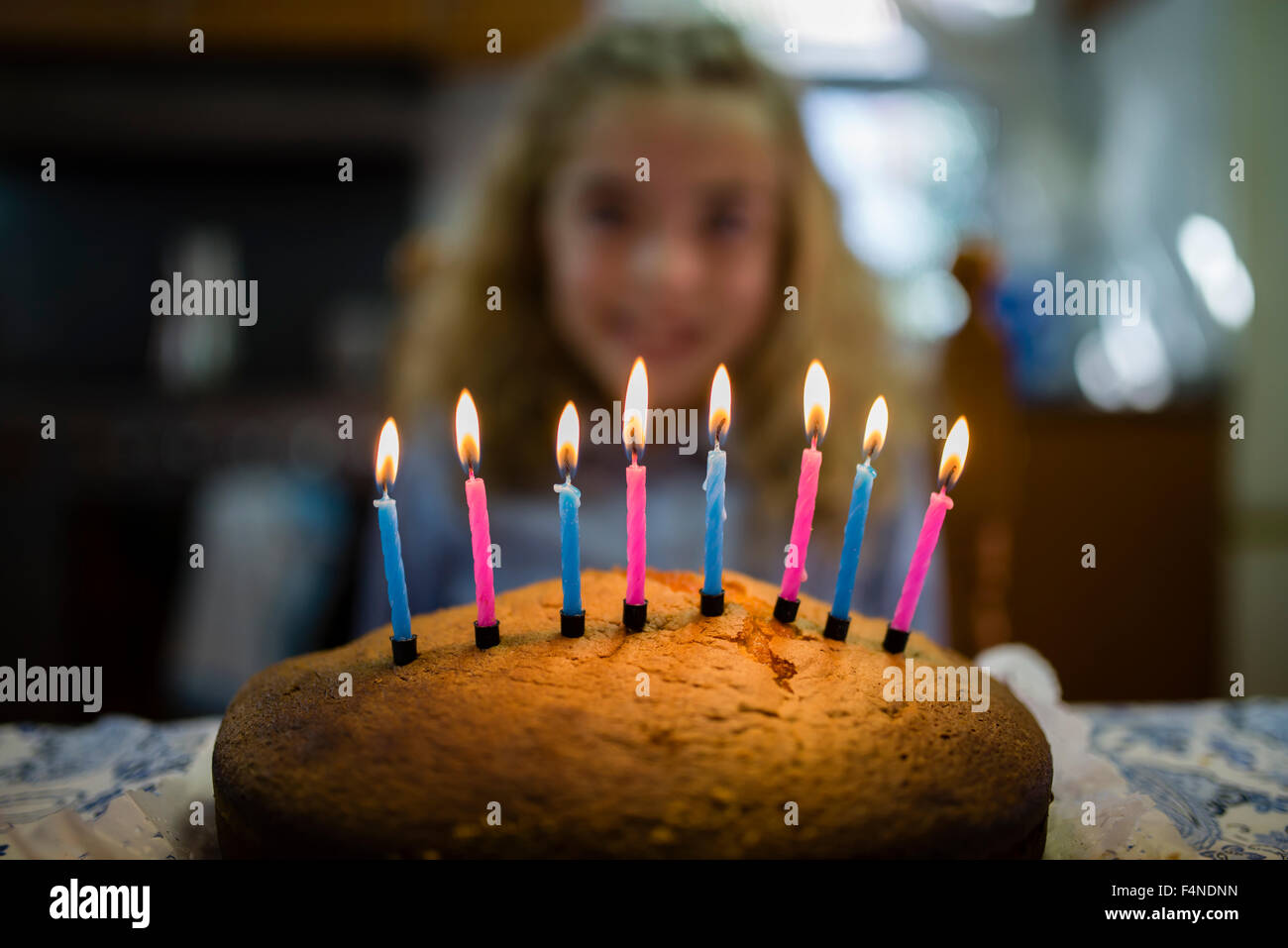 Lighted candles on a birthday cake Stock Photo - Alamy