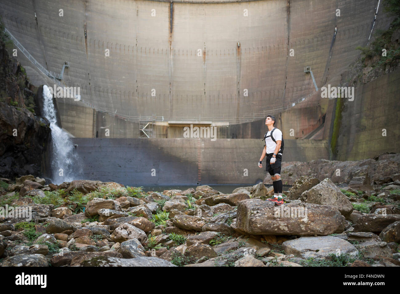 Ultra trail runner with a dam in the background Stock Photo - Alamy