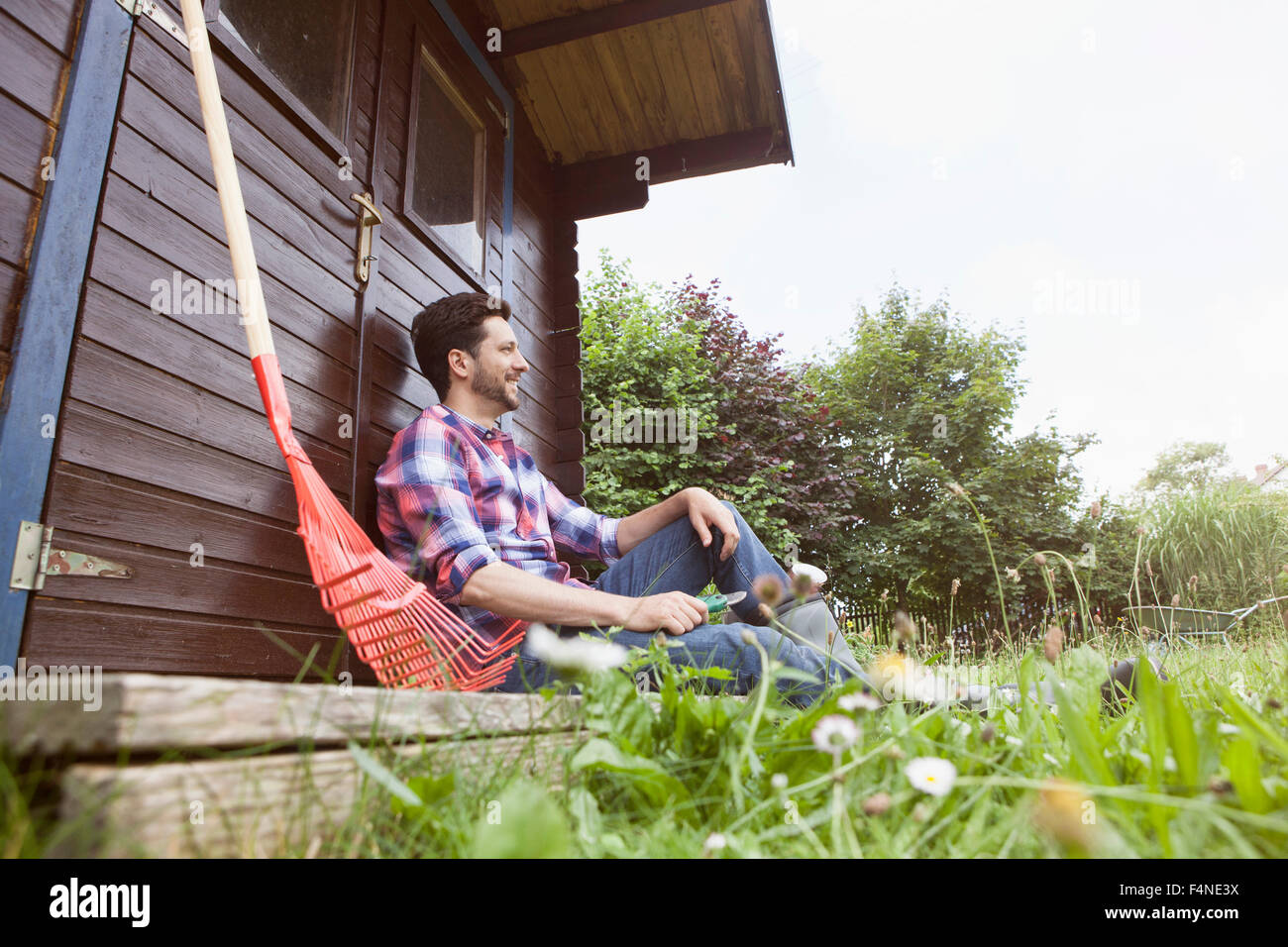 Man relaxing from gardening Stock Photo - Alamy