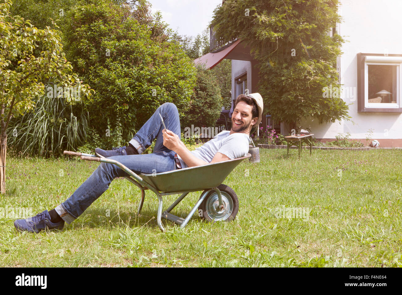 Man With Wheelbarrow Stock Photos & Man With Wheelbarrow Stock Images ...