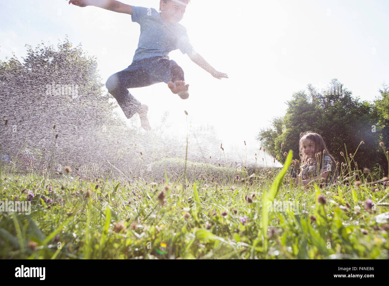 Boy jump water hi-res stock photography and images - Alamy