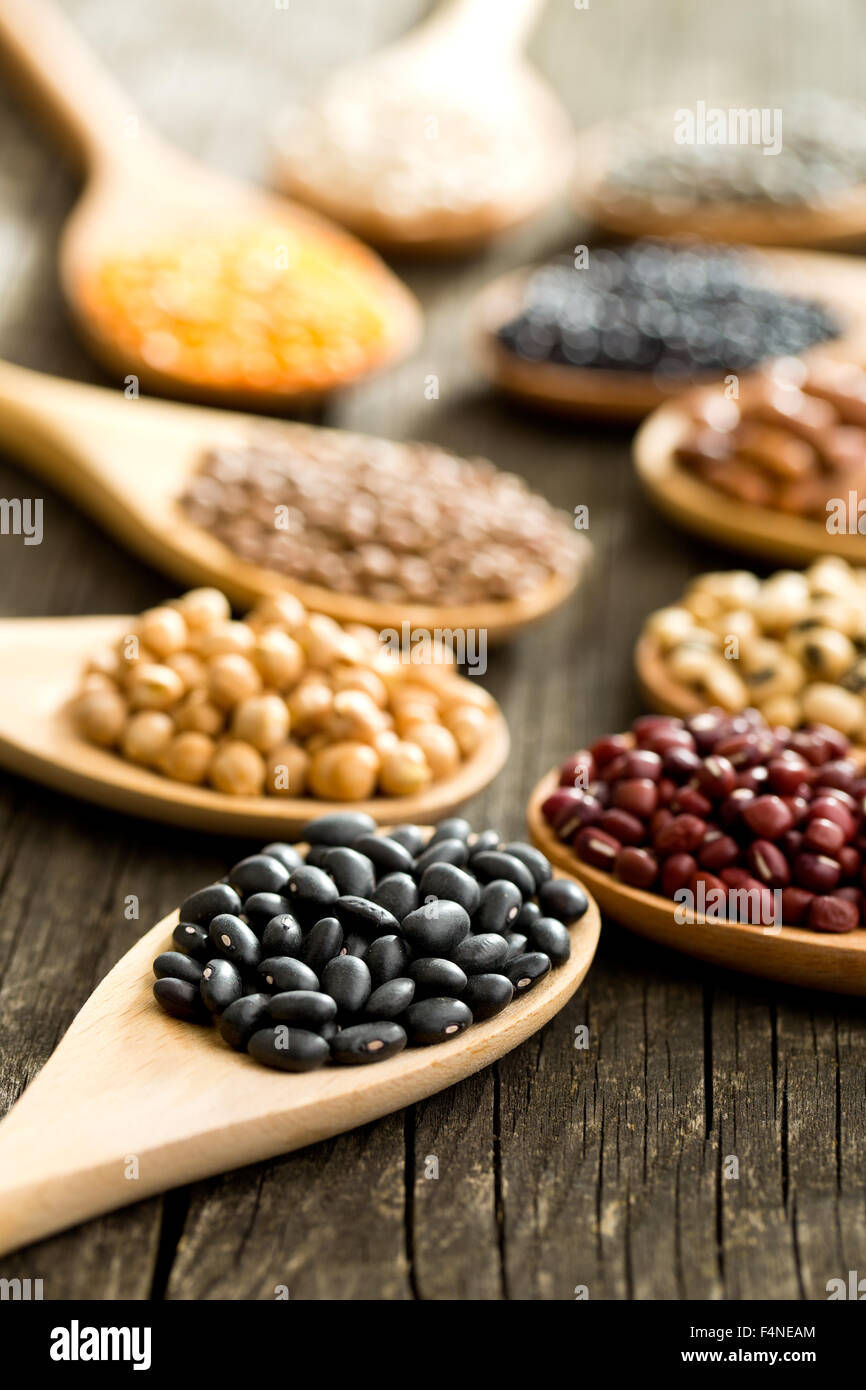Various dried legumes in wooden shop shelfs Stock Photo - Alamy