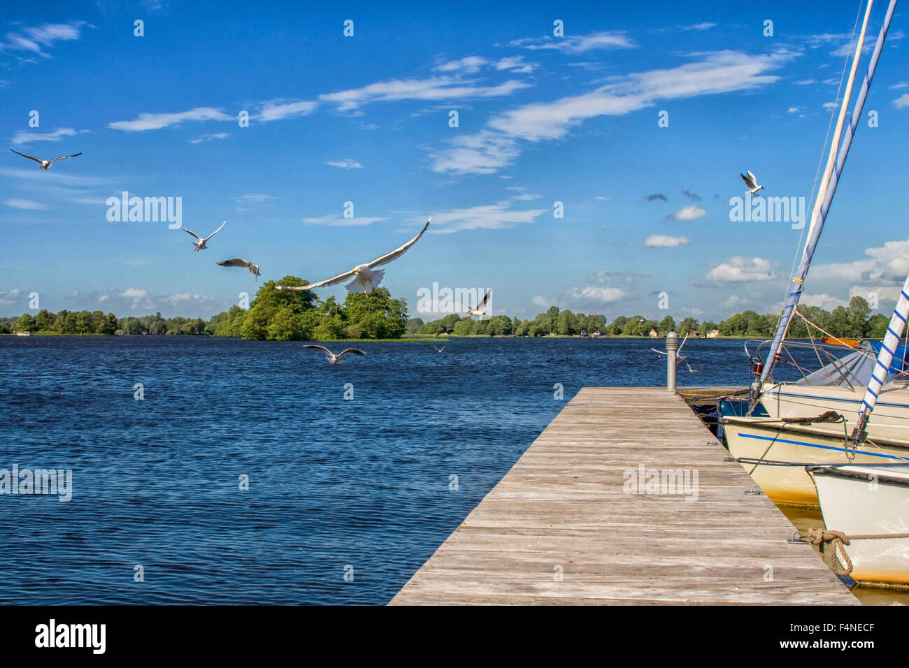 Jetty with boats hi-res stock photography and images - Alamy