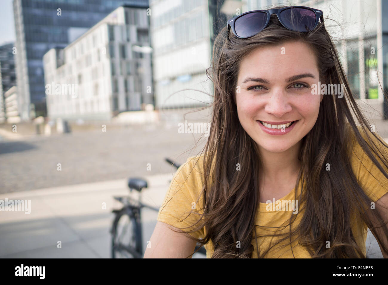 Germany, Cologne, portrait of smiling young woman Stock Photo - Alamy