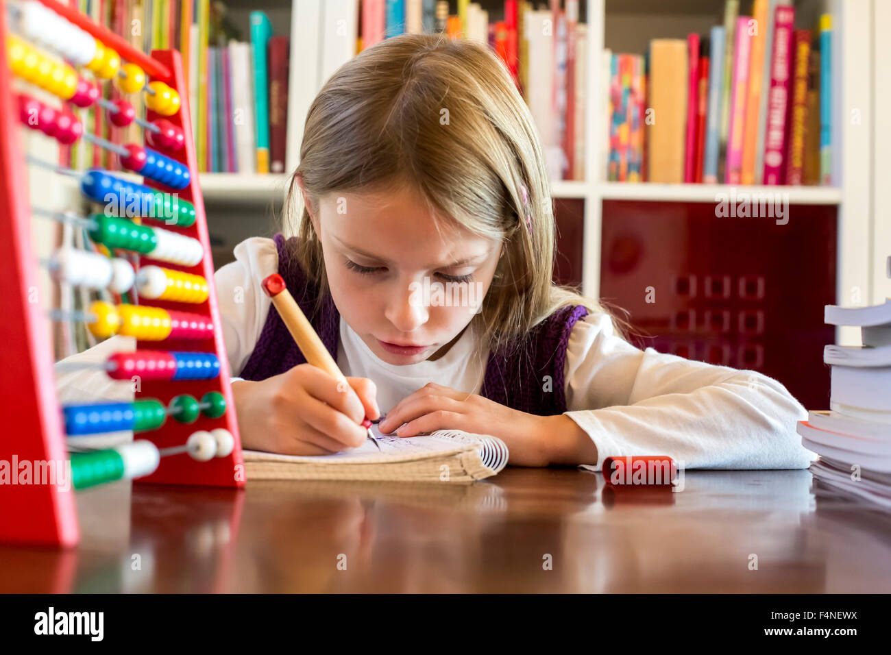 Girl doing homework Stock Photo - Alamy