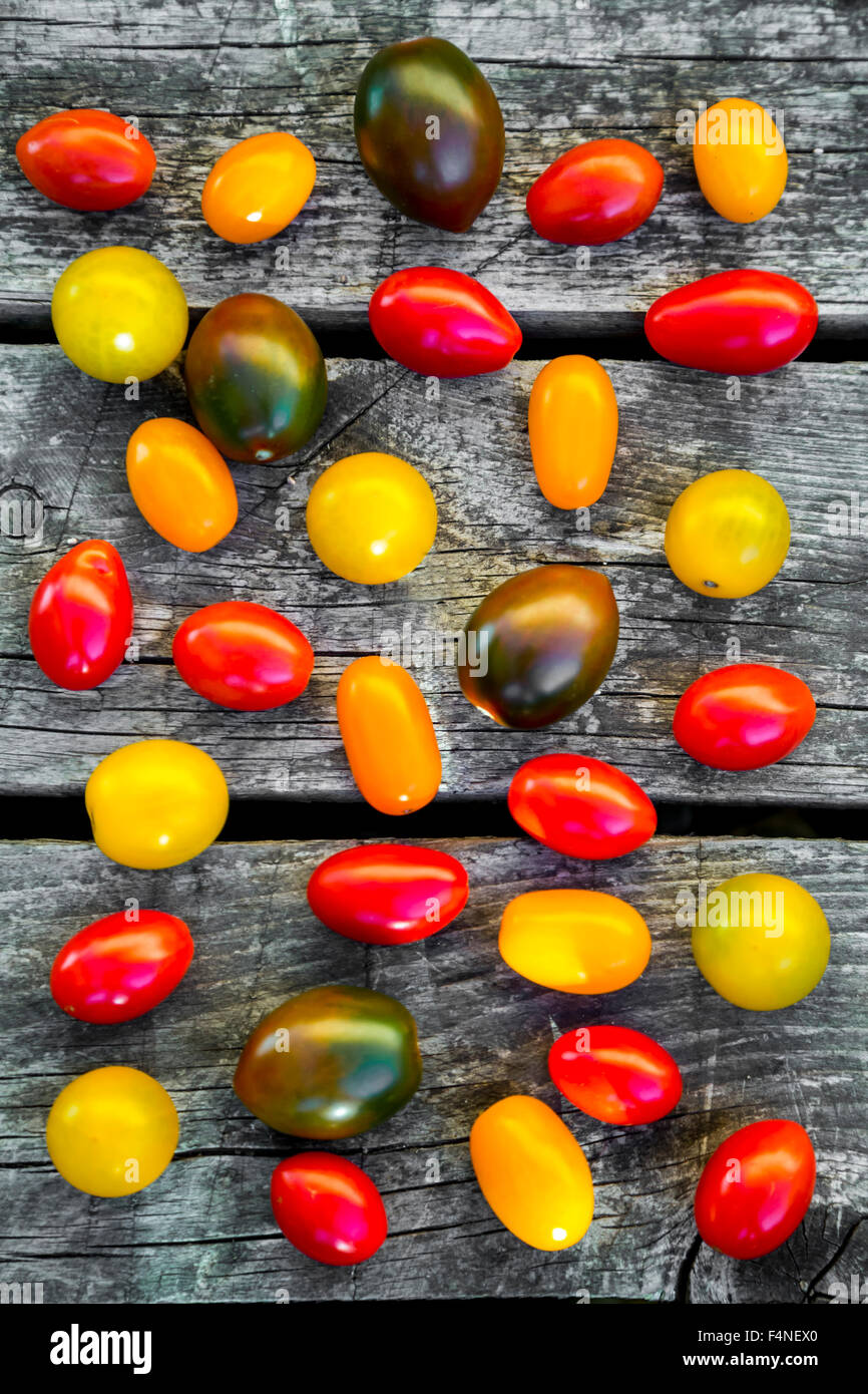 Colorful mini tomatoes on wood Stock Photo - Alamy