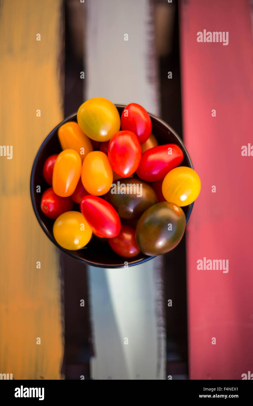 Colorful mini tomatoes in a cup Stock Photo - Alamy