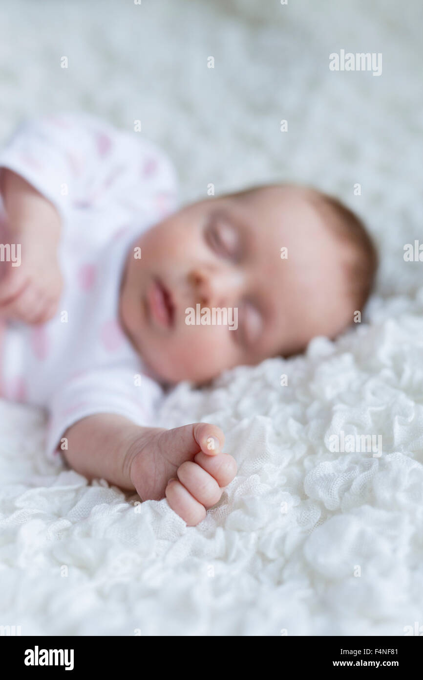 Hand of sleeping newborn baby girl Stock Photo - Alamy