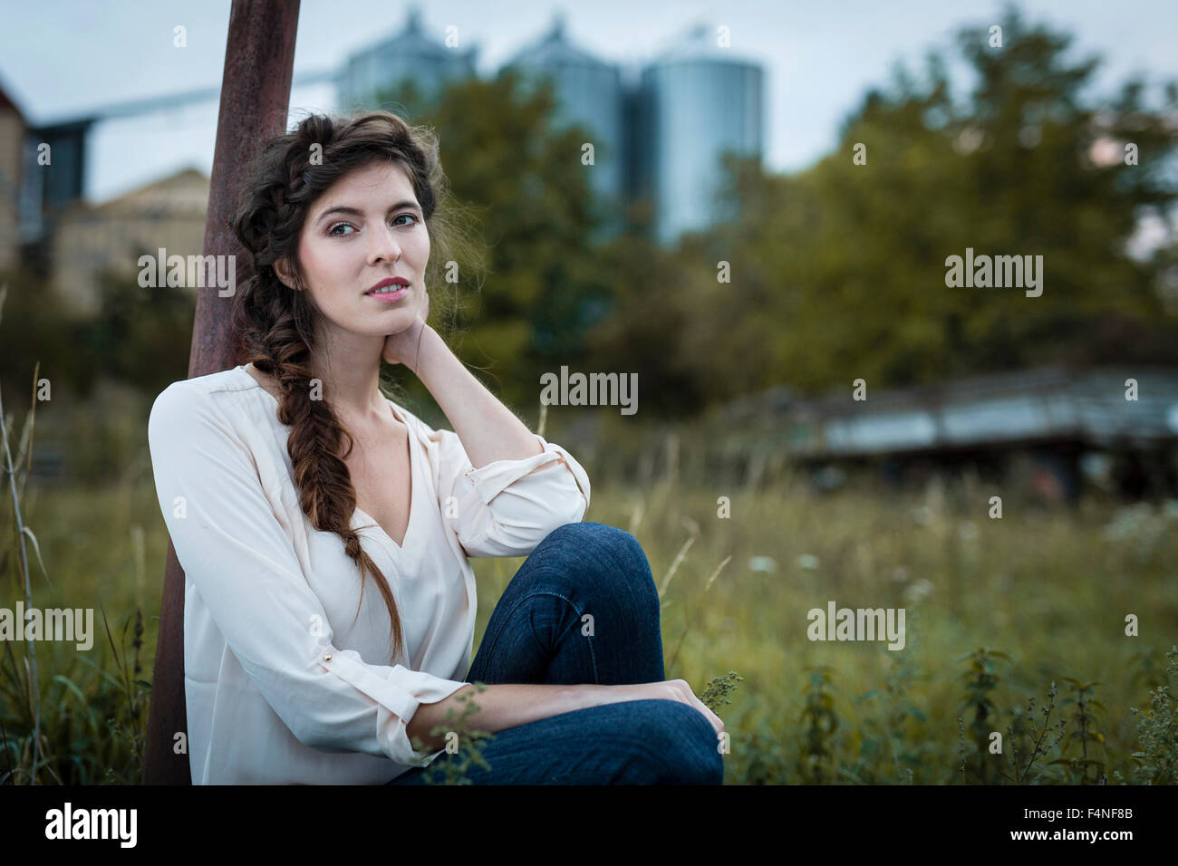Woman leaning against pole on hi-res stock photography and images - Alamy