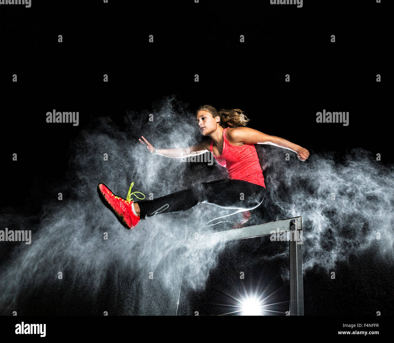 Hurdler in mid air hi-res stock photography and images - Alamy