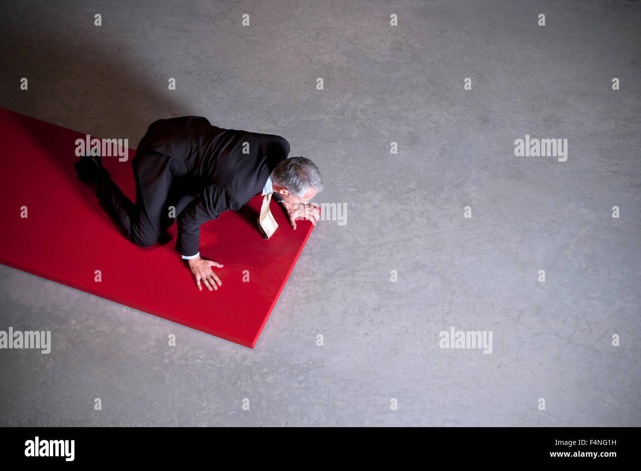 Man kneeling suit hi-res stock photography and images - Alamy