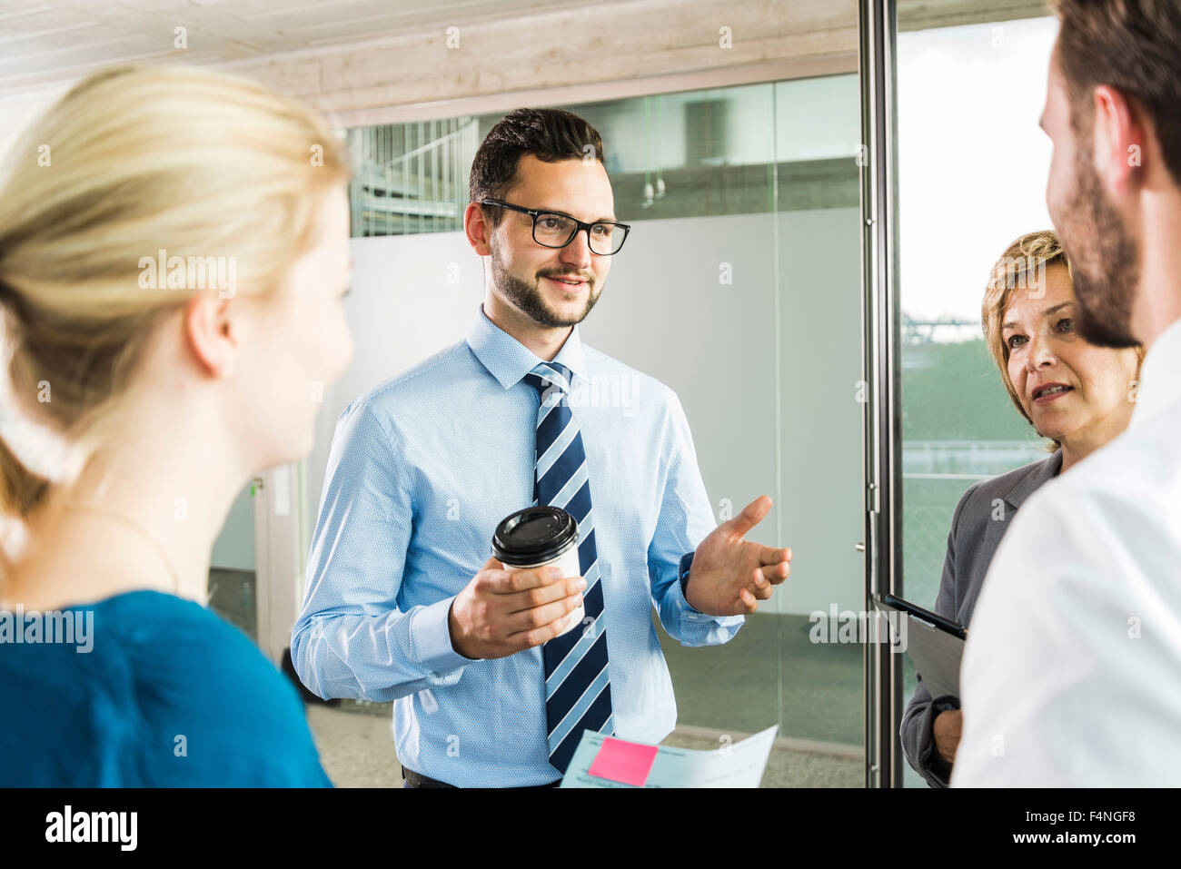 Business people talking in office Stock Photo - Alamy