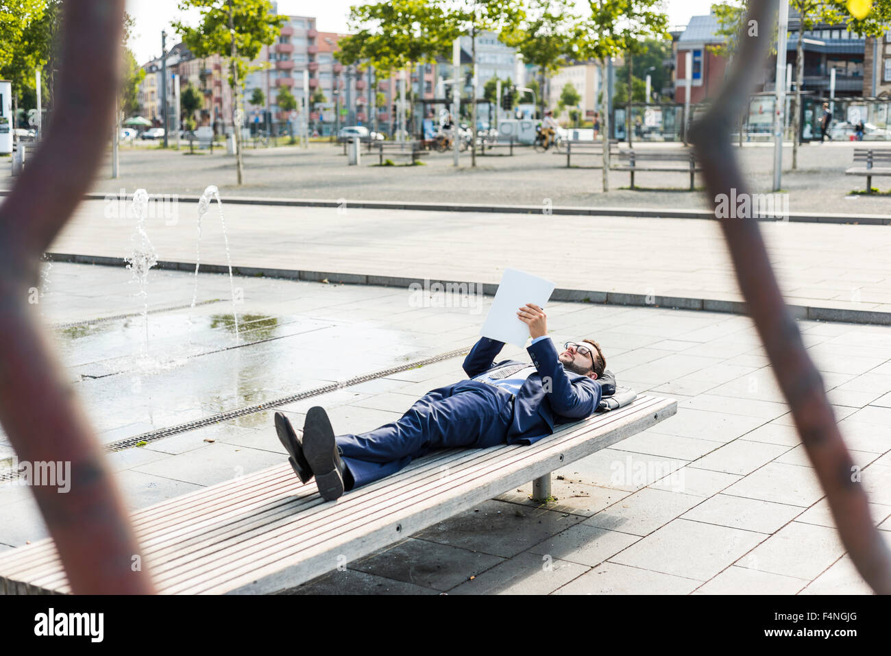 Young man lying on work bench hi-res stock photography and images - Alamy
