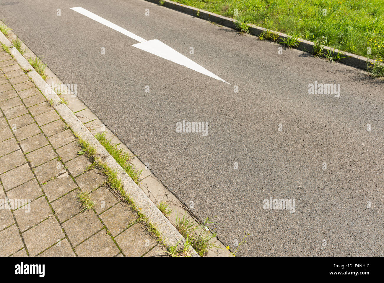 Germany, empty lane with arrow sign Stock Photo - Alamy