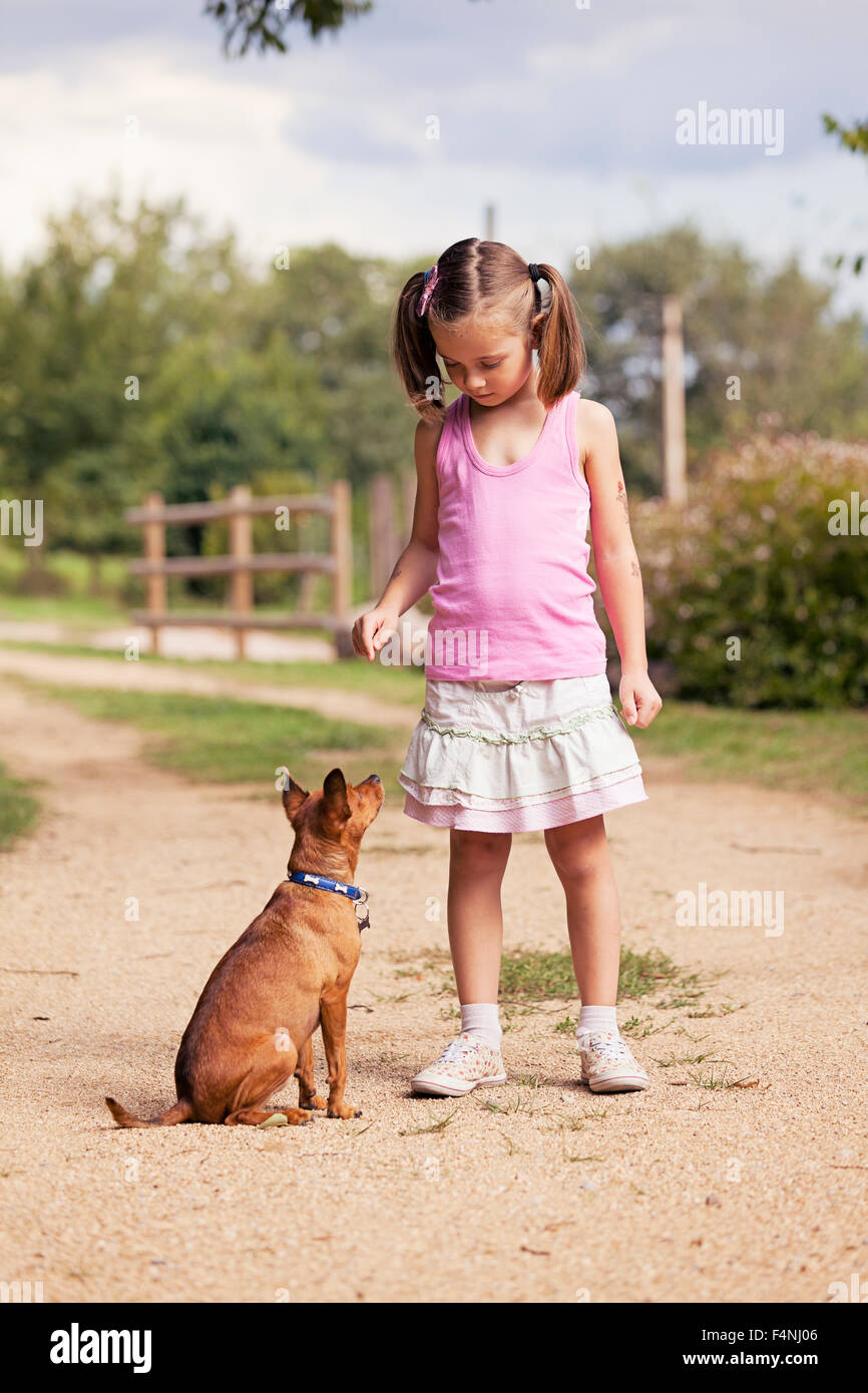 Little girl with her dog Stock Photo - Alamy
