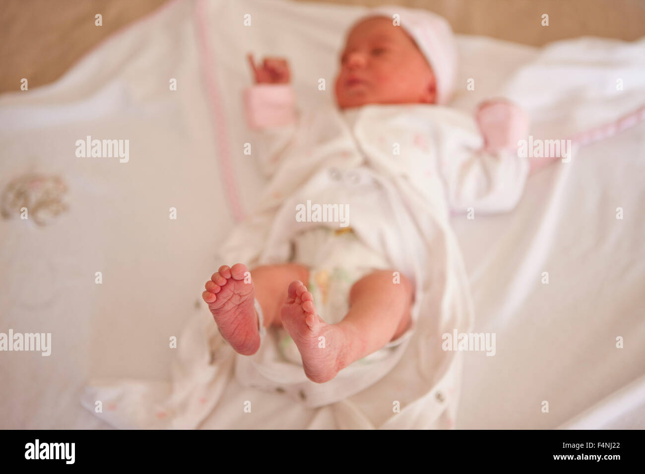Newborn baby lying Stock Photo - Alamy