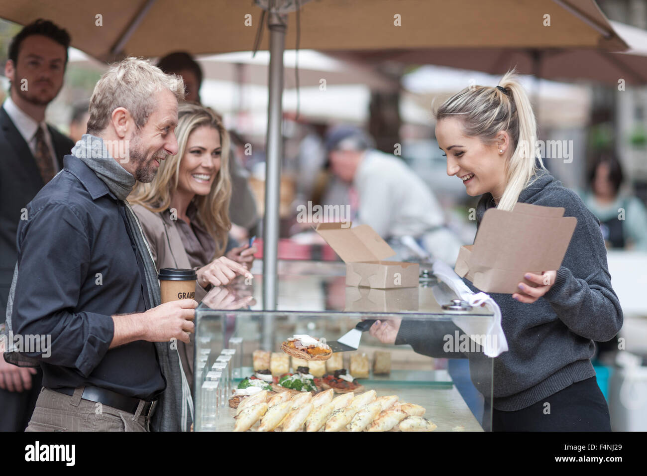 People buying food at city market Stock Photo - Alamy