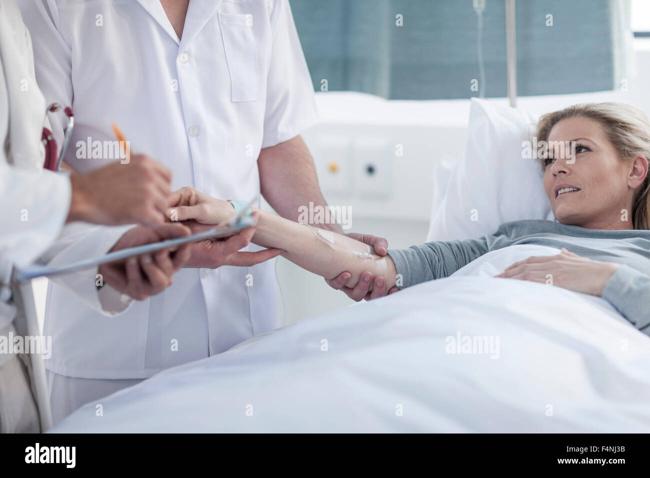 Patient in hospital getting checked Stock Photo - Alamy