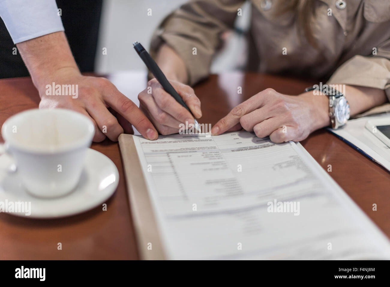 Woman signing sales contract close hi-res stock photography and images ...