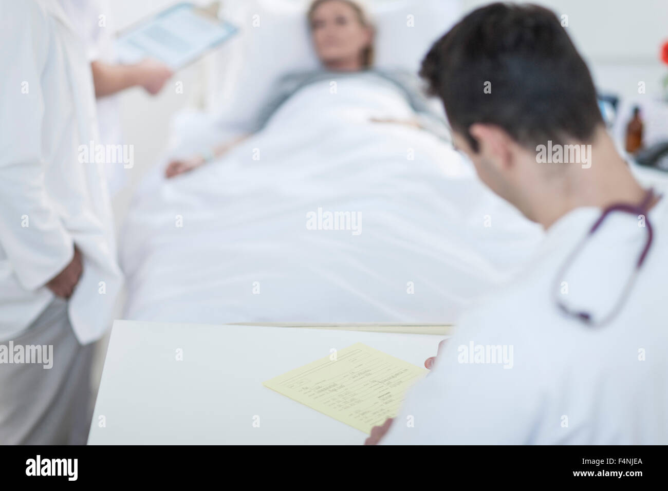 Doctor's checking on patient in hospital Stock Photo - Alamy