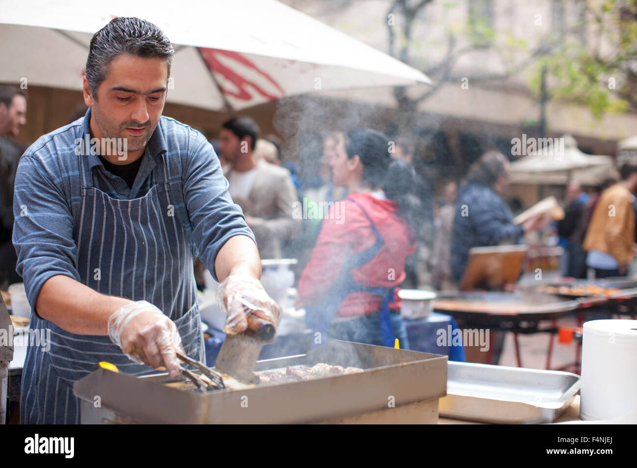 Man barbecueing meat hi-res stock photography and images - Alamy