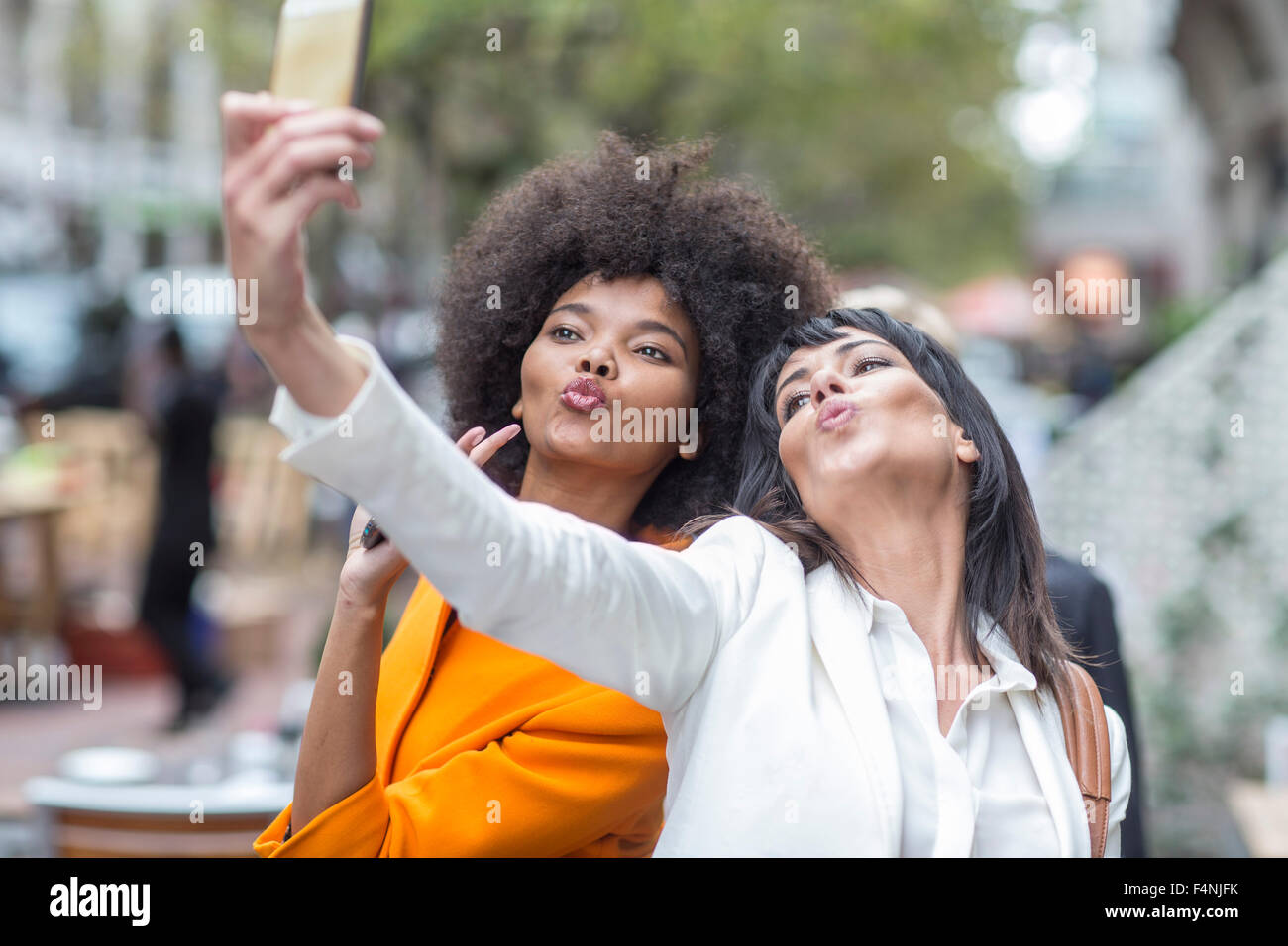 Two friends posing for a selfie Stock Photo - Alamy