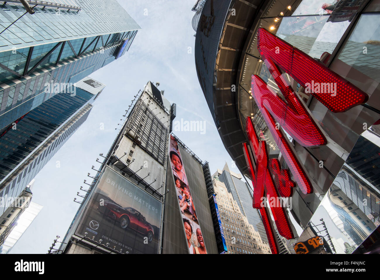 Looking up at skyscrapers in Times Square, Midtown Manhattan New York ...