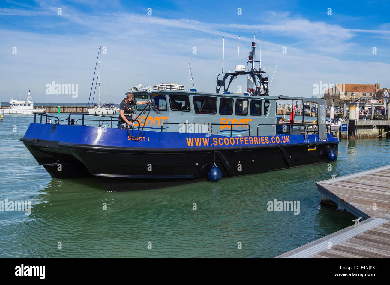 The solent isle of wight ferries in the harbour hi-res stock ...