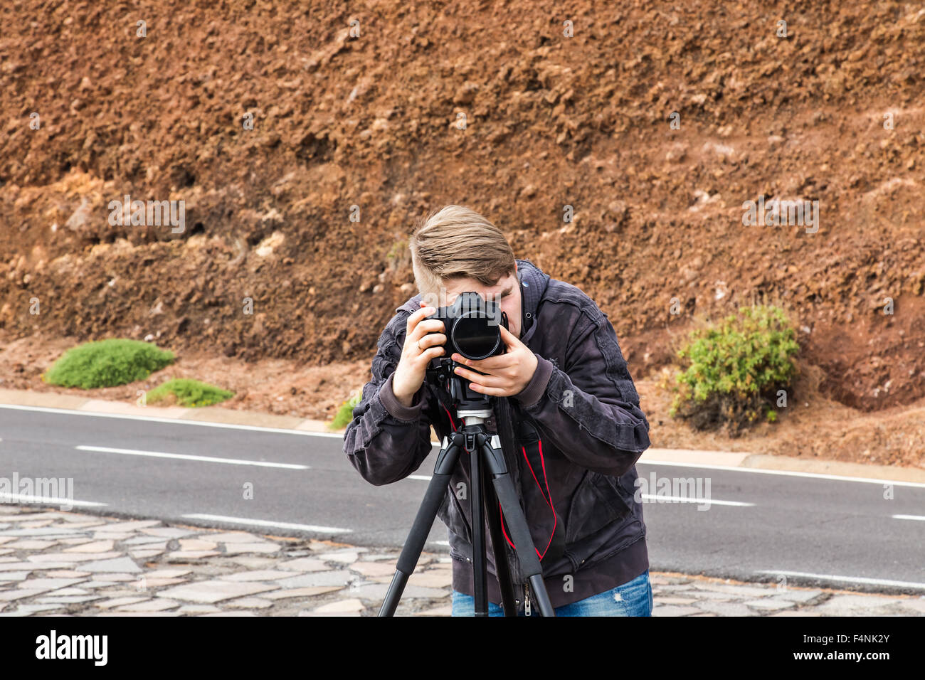 photographer taking photo in wild Stock Photo - Alamy