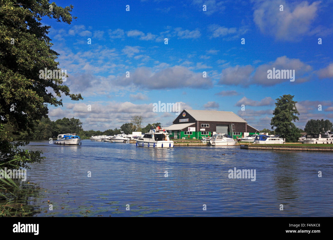 A view of the River Bure and boatyard on the Norfolk Broads at Horning ...