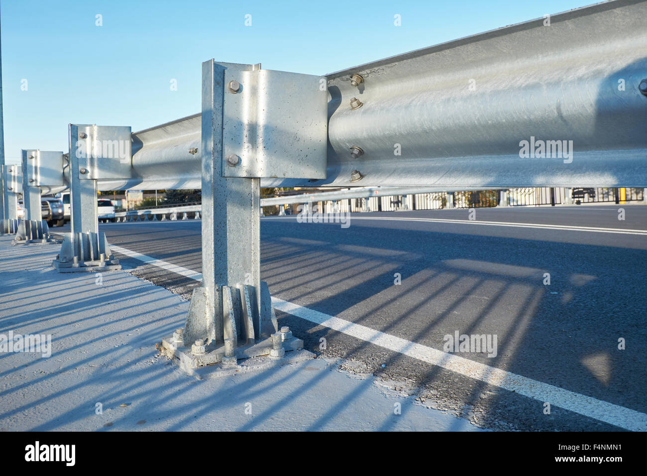 Anodized safety steel barrier on freeway bridge Stock Photo - Alamy