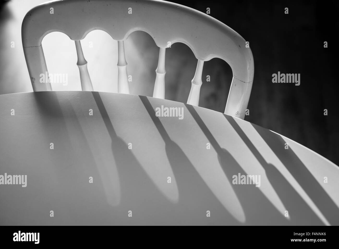Shadow cast by chair in black and white Stock Photo - Alamy
