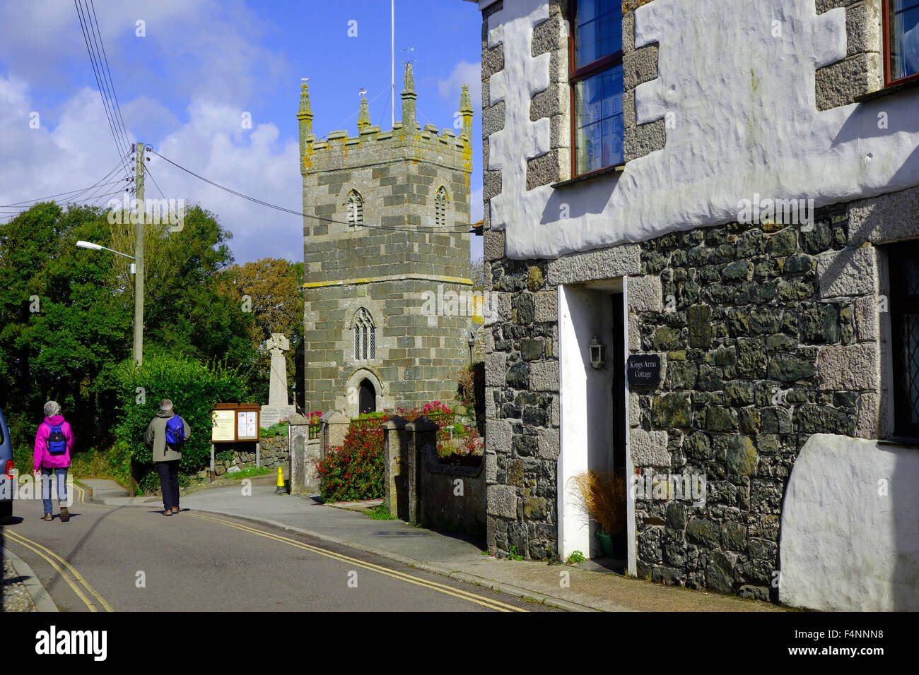 Walkers in Mullion Village, Lizard Peninsula, Cornwall, England, UK in ...