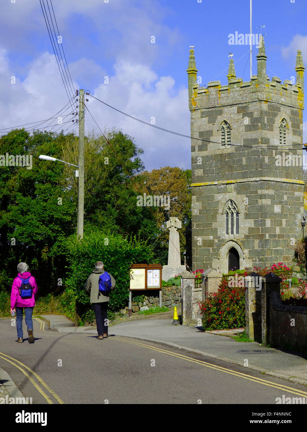 Walkers in Mullion Village, Lizard Peninsula, Cornwall, England, UK in ...