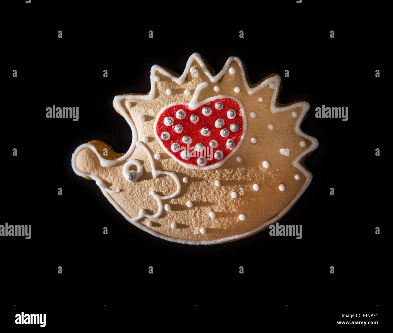 Tasty gingerbread hedgehog on the dark background. Christmas theme ...